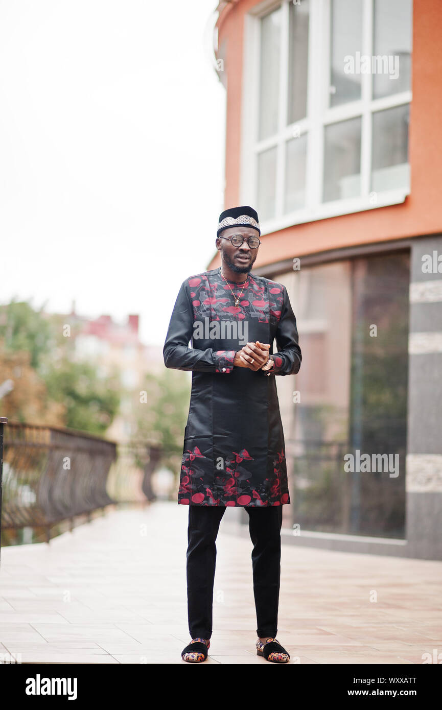 Handsome afro american man wearing traditional clothes, cap and ...