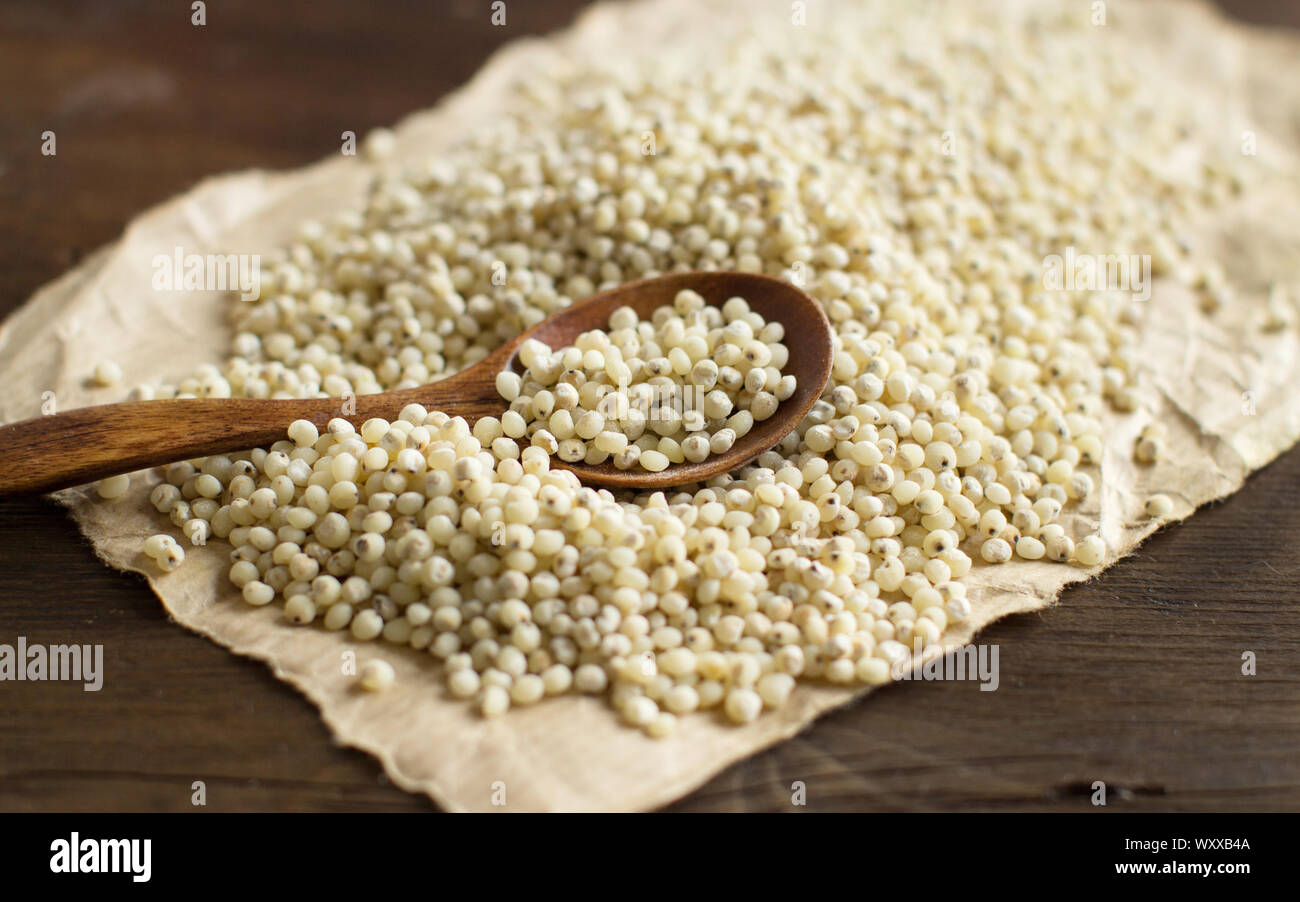 White Sorghum grain with a spoon close up Stock Photo - Alamy