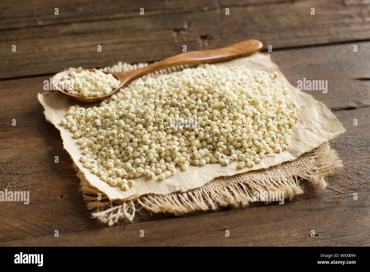 White Sorghum grain with a spoon close up Stock Photo - Alamy