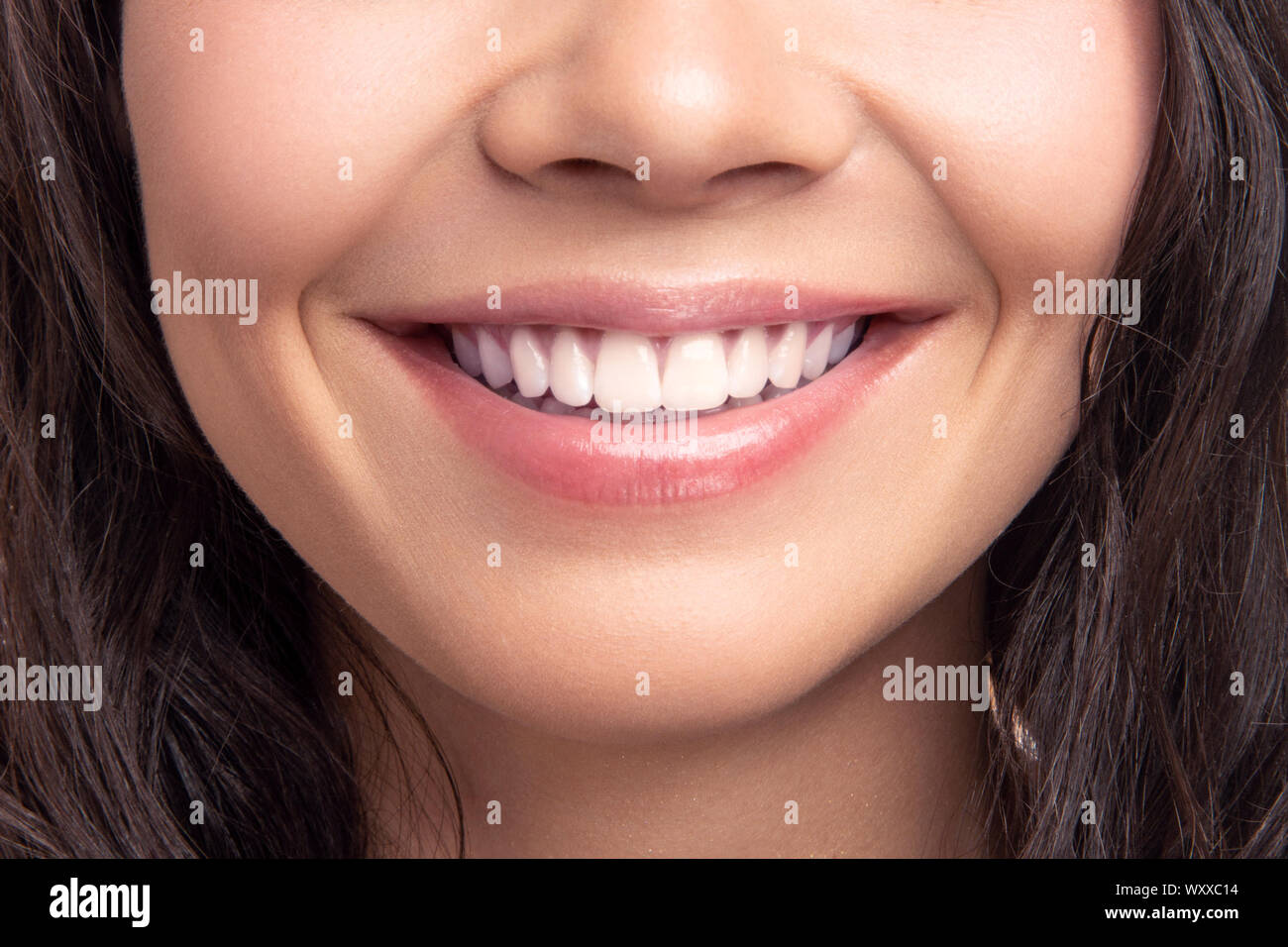 Closeup smile of young teen happy female woman great white teeth ...