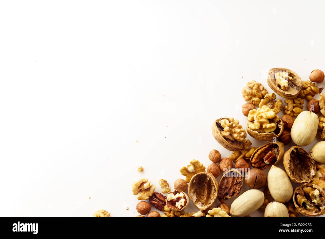 Overhead image of a group of various nuts with nutshells isolated on ...