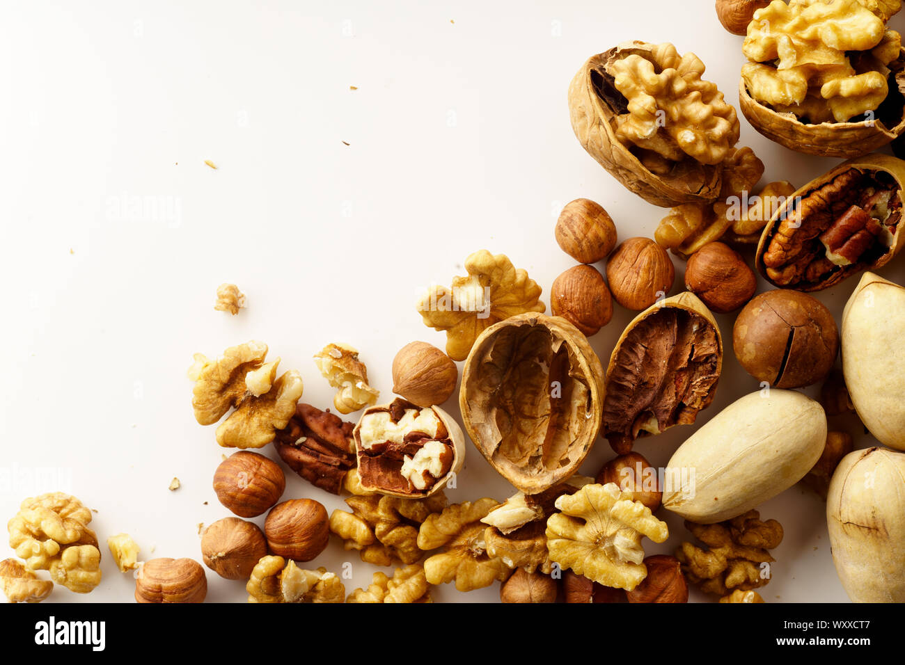 Overhead image of a group of various nuts with nutshells isolated on ...