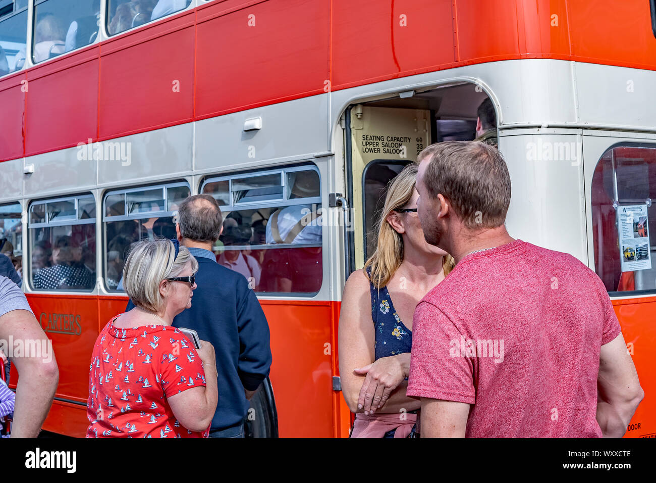 Passengers waiting to board the vintage bus from Sheringham to Holt ...