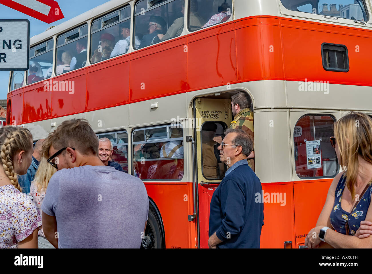 Passengers waiting to board the vintage bus from Sheringham to Holt ...