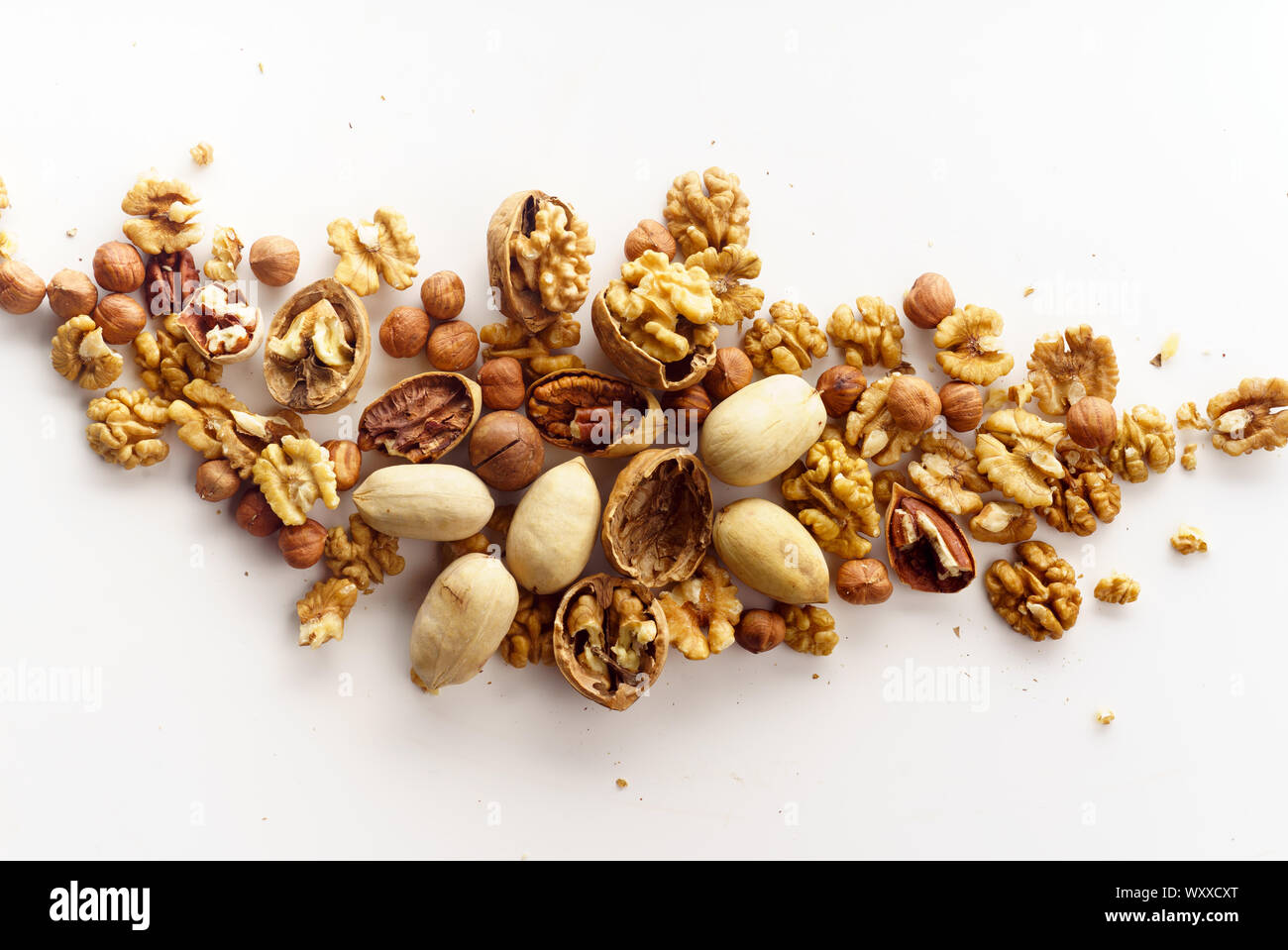 Overhead image of a group of various nuts with nutshells isolated on ...