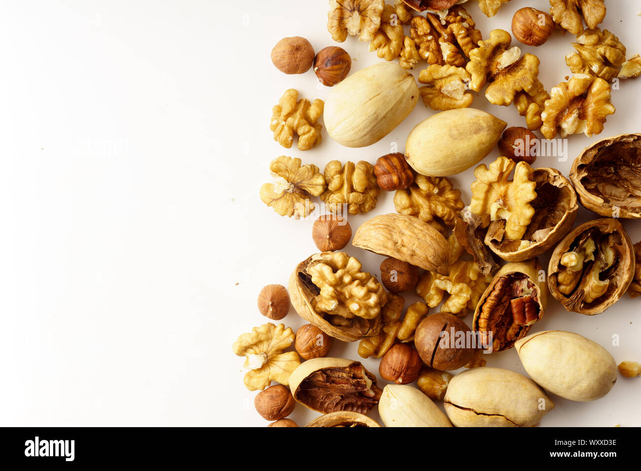 Overhead image of a group of various nuts with nutshells isolated on ...