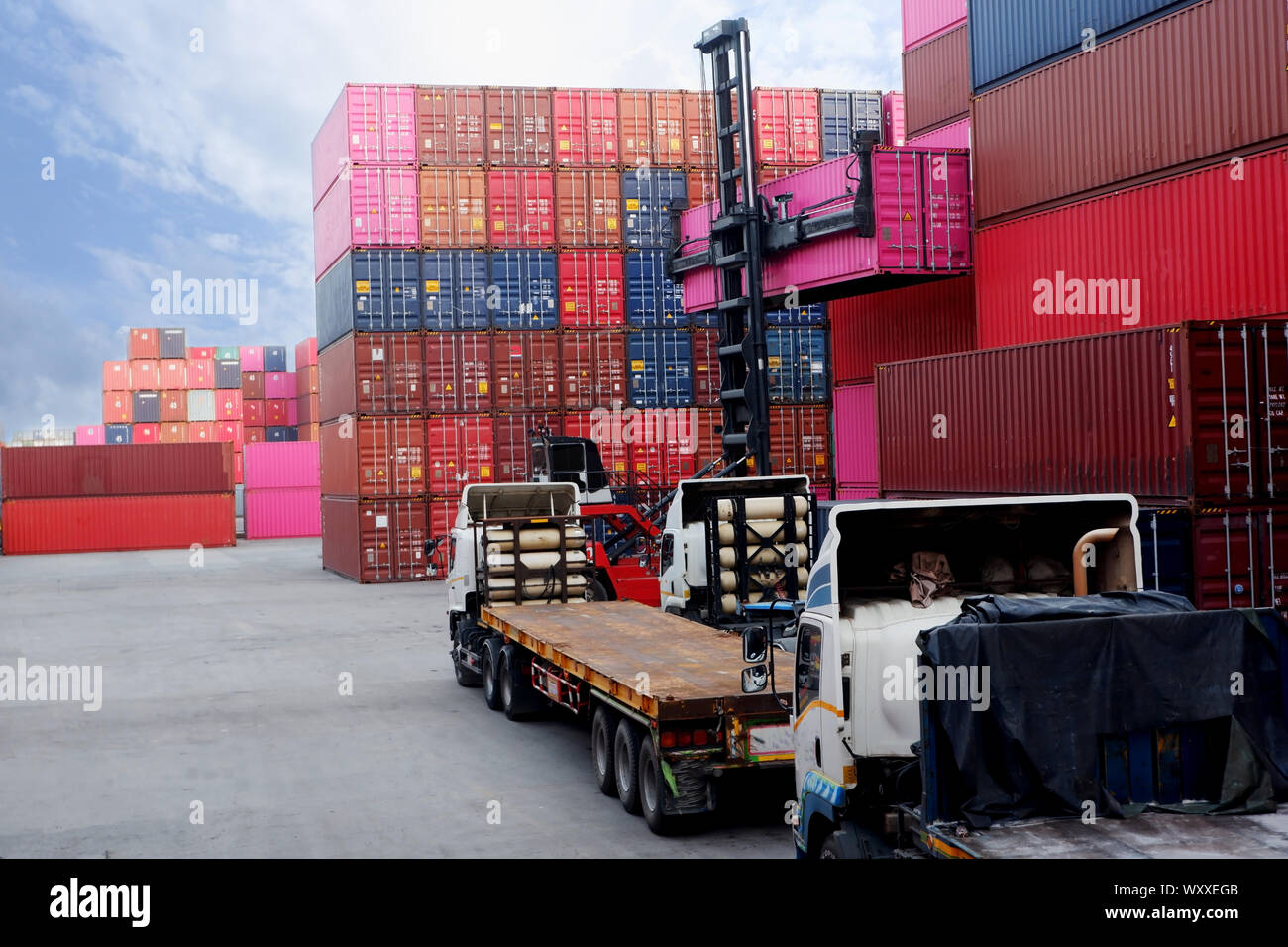 The truck is waiting to load the container in the port Stock Photo - Alamy