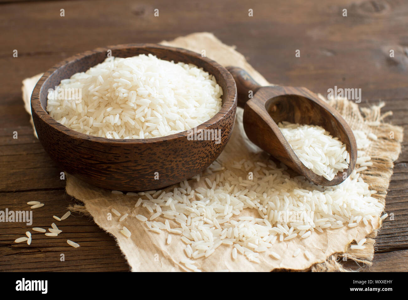 Pile of Basmati rice in a bowl with a spoon close up Stock Photo - Alamy