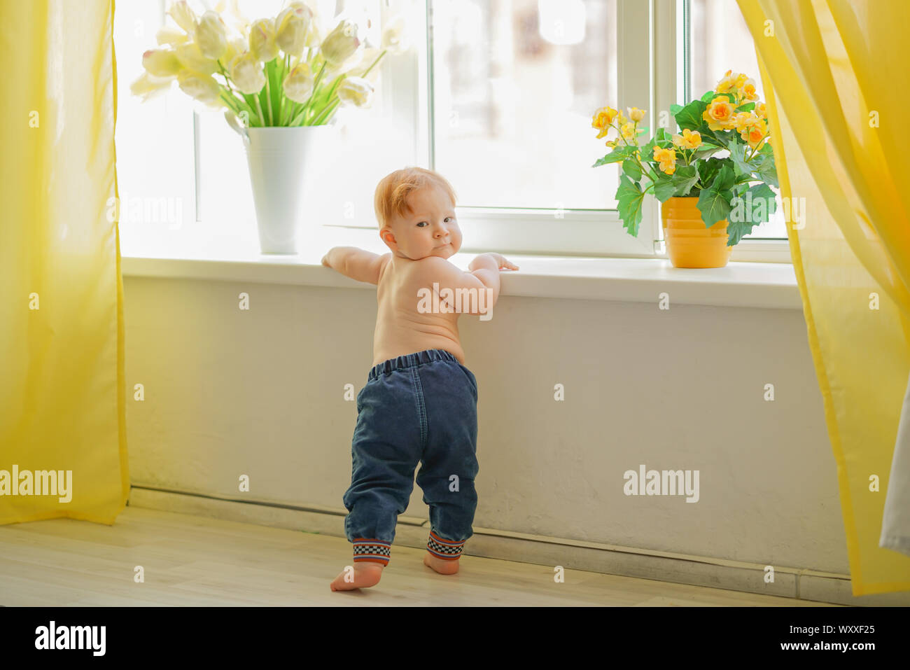 a little boy looks in the window. a dangerous situation when a small ...