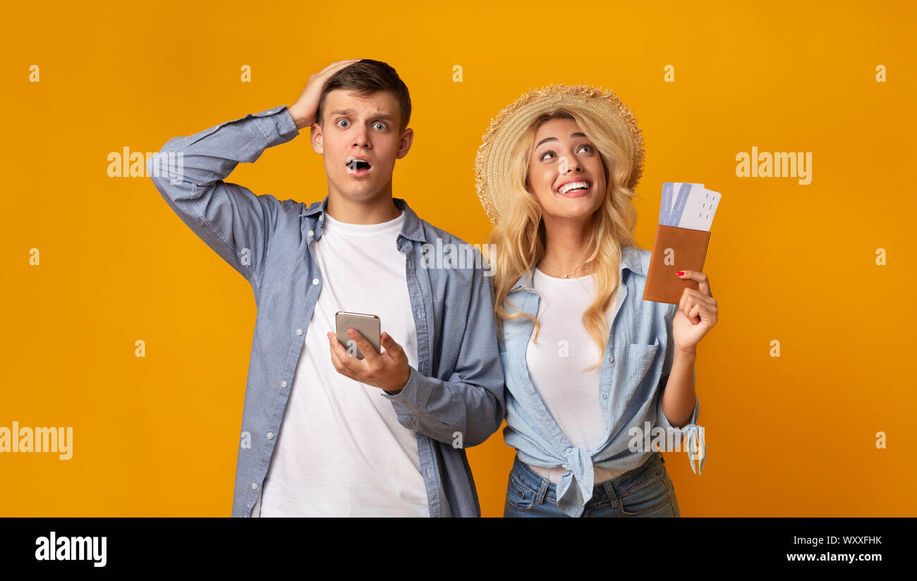 Flight cancelled. Frustrated guy holding smartphone with desperate face ...