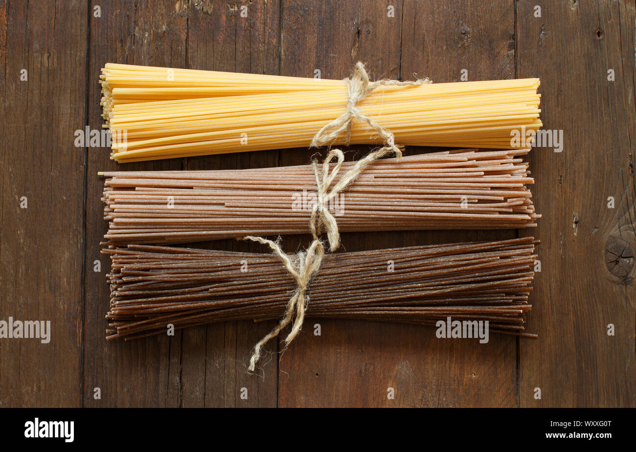 Italian spaghetti on the old wooden table top view Stock Photo - Alamy