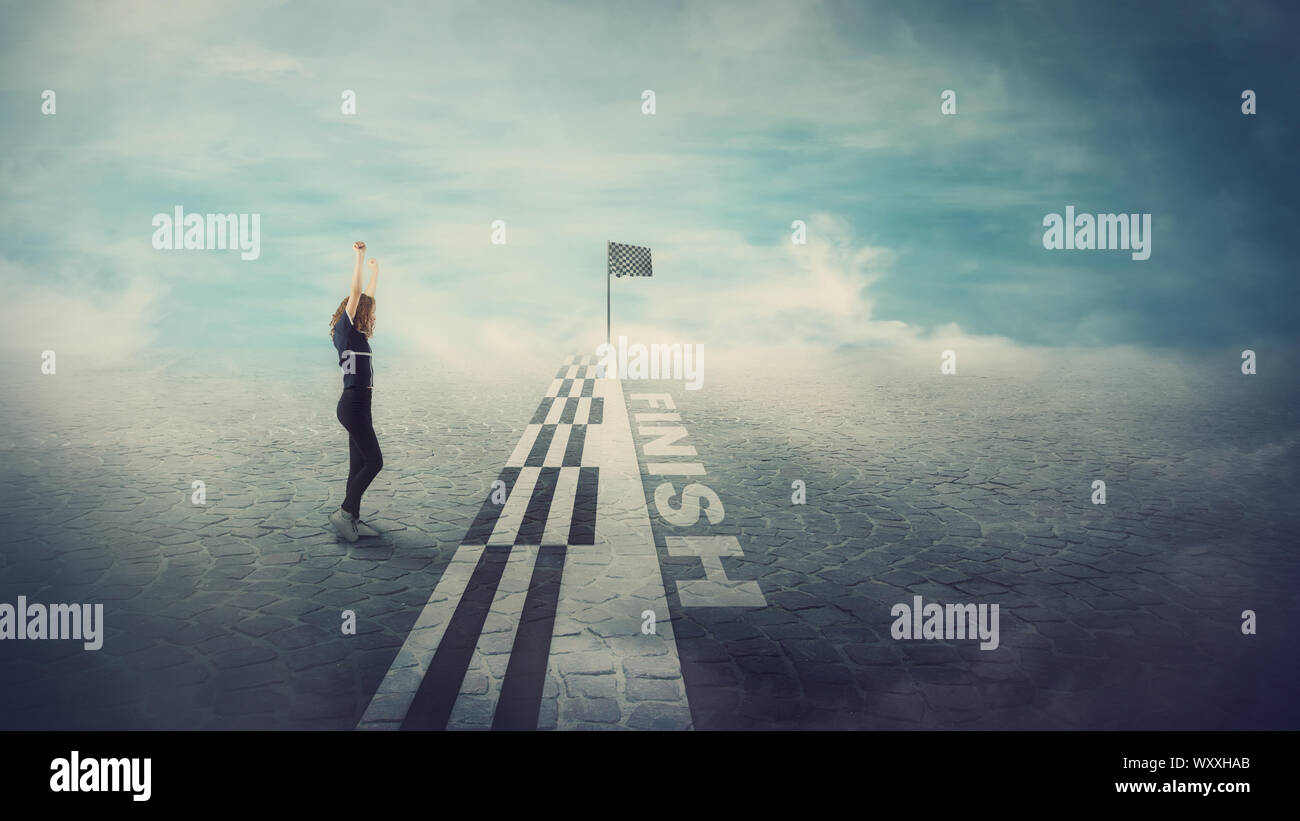 Side view of competitive girl confident crossing the finish line ...