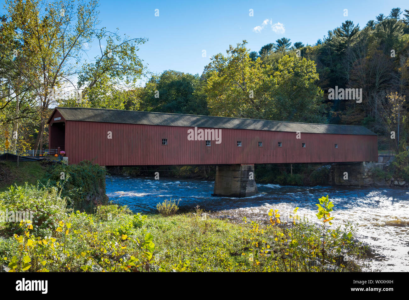 Side view of the wooden structure of West Cornwall covered bridge and ...