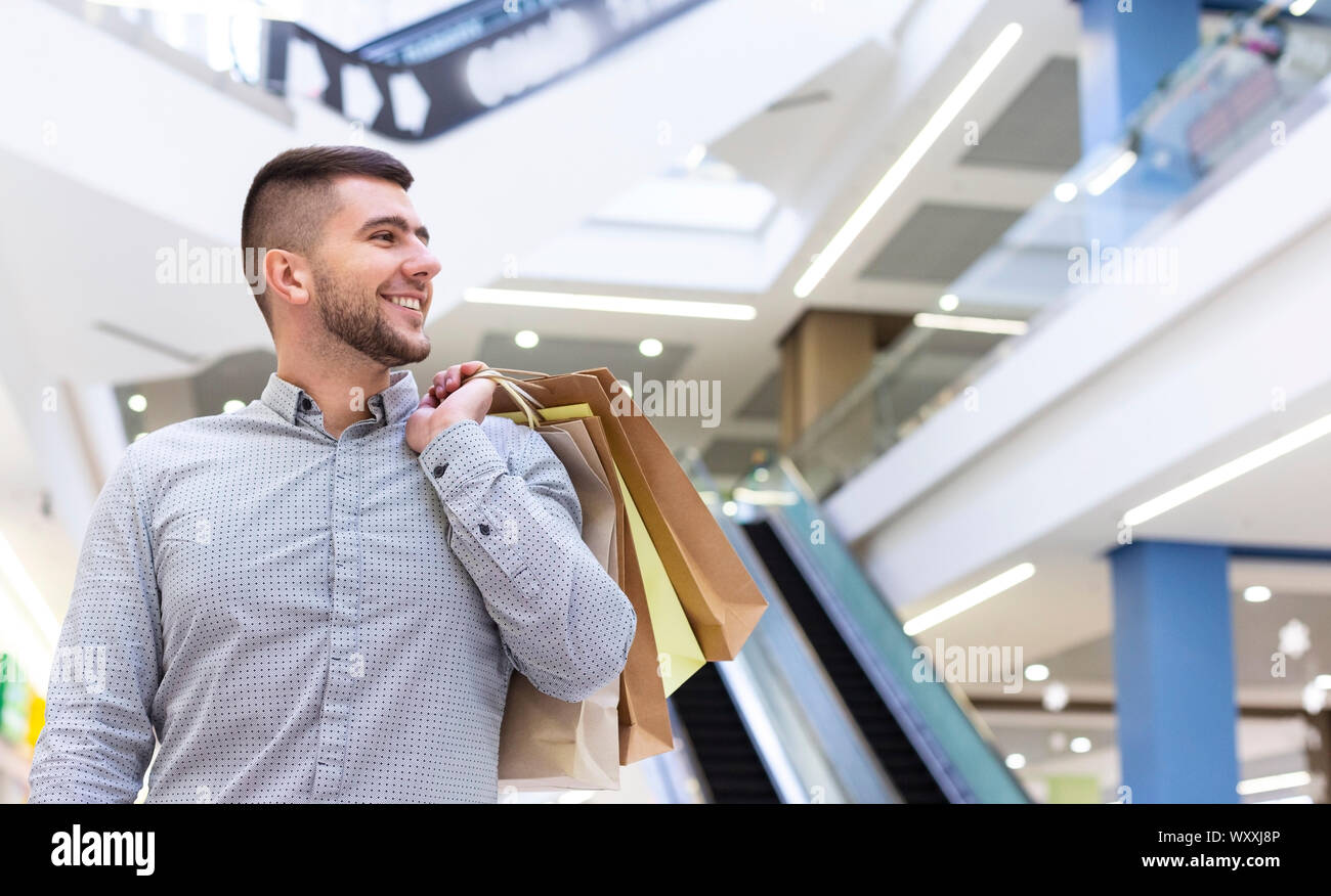 Smiling handsome man waiting girlfriend hi-res stock photography and ...