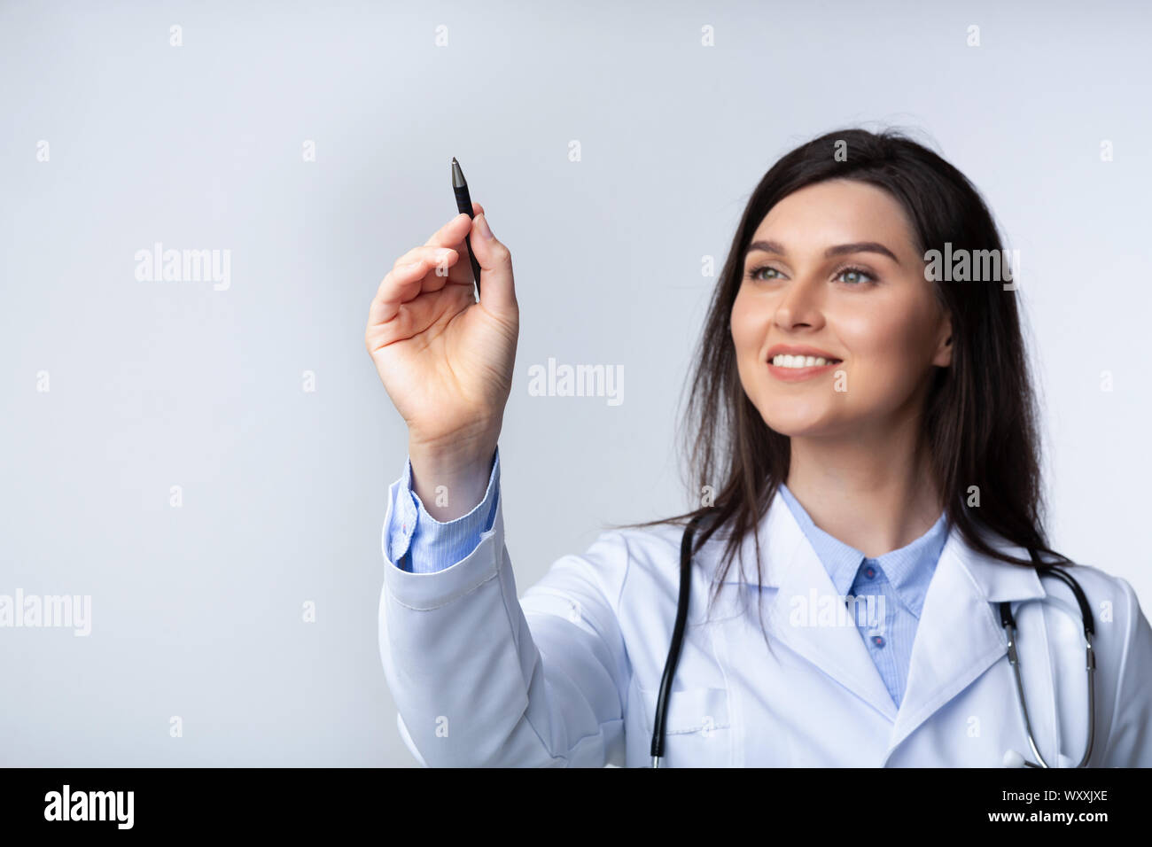 Doctor Using Invisible Virtual Screen And Stylus Over White Background ...