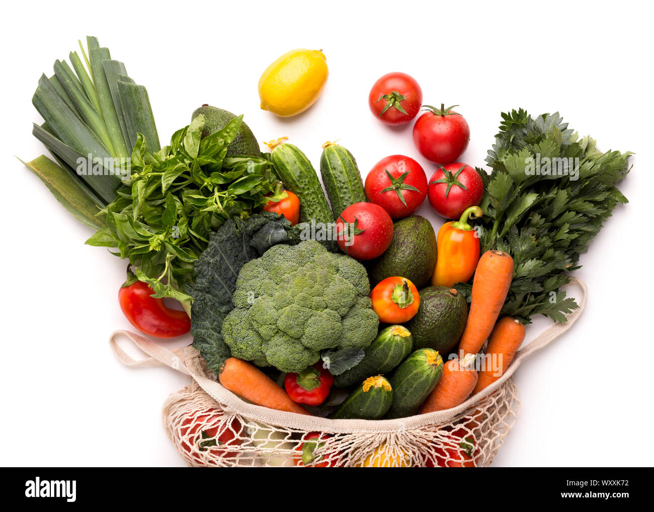 Fresh vegetables from farm inside eco bag on white Stock Photo - Alamy