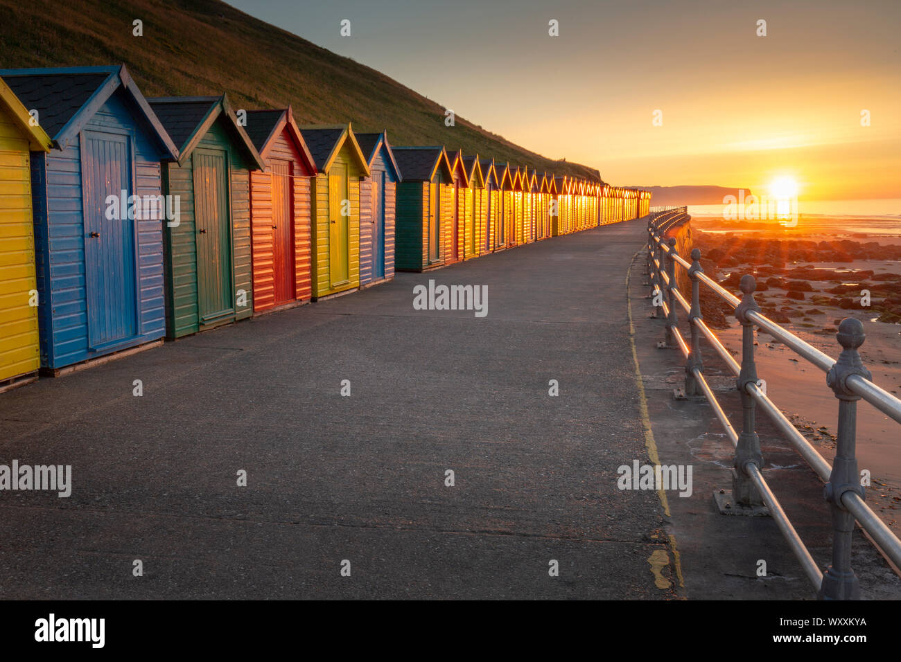 Whitby colourful beach huts on the promenade in North Yorkshire at ...