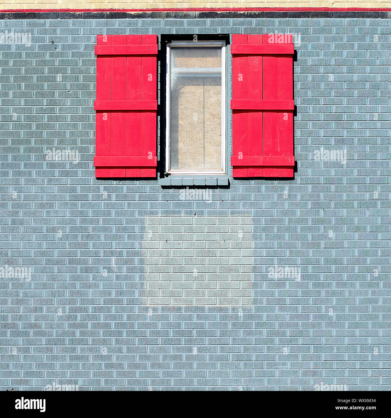 Blue Brick Wall, Red Window Stock Photo - Alamy