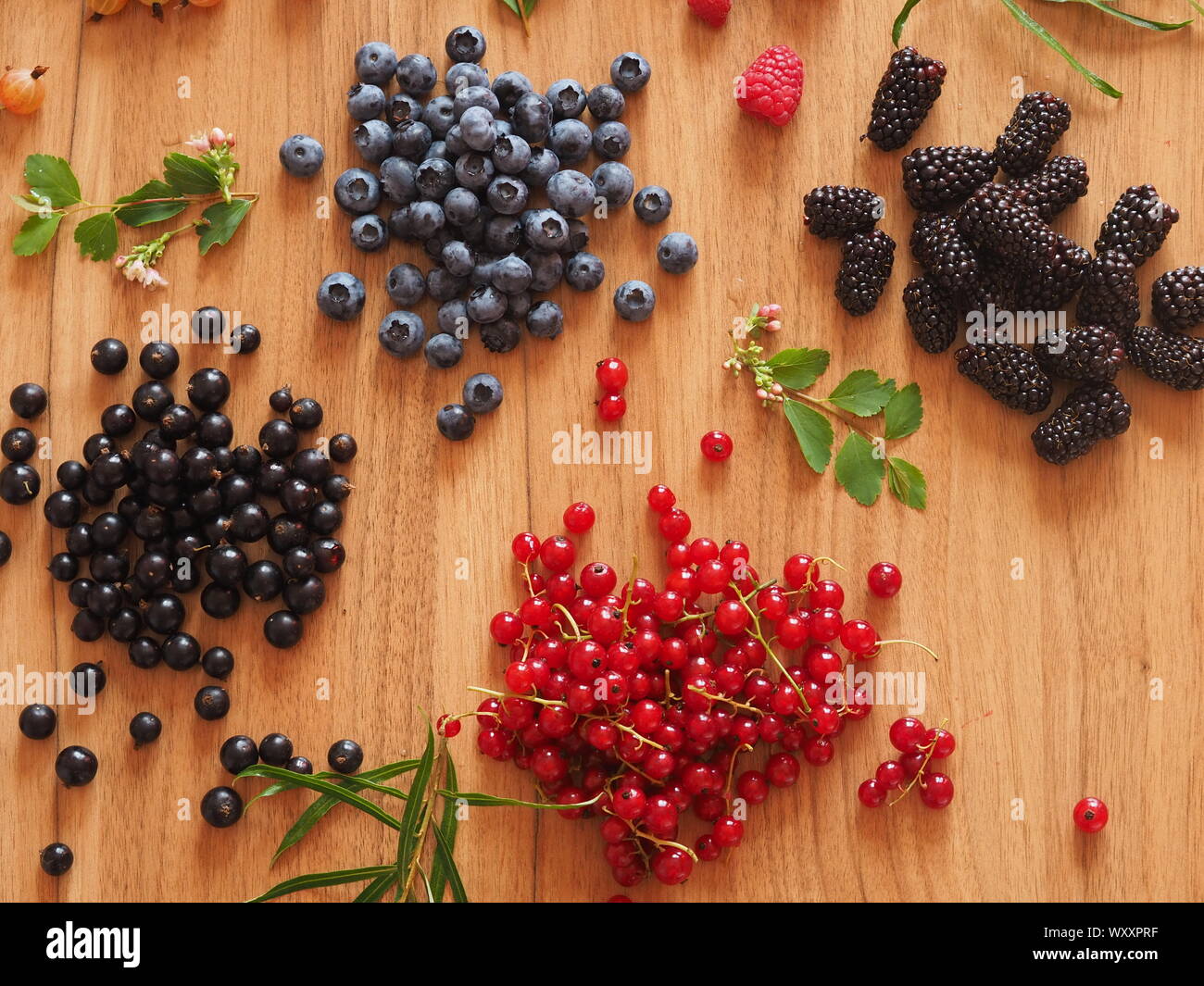 summer berries on a wooden table Stock Photo - Alamy