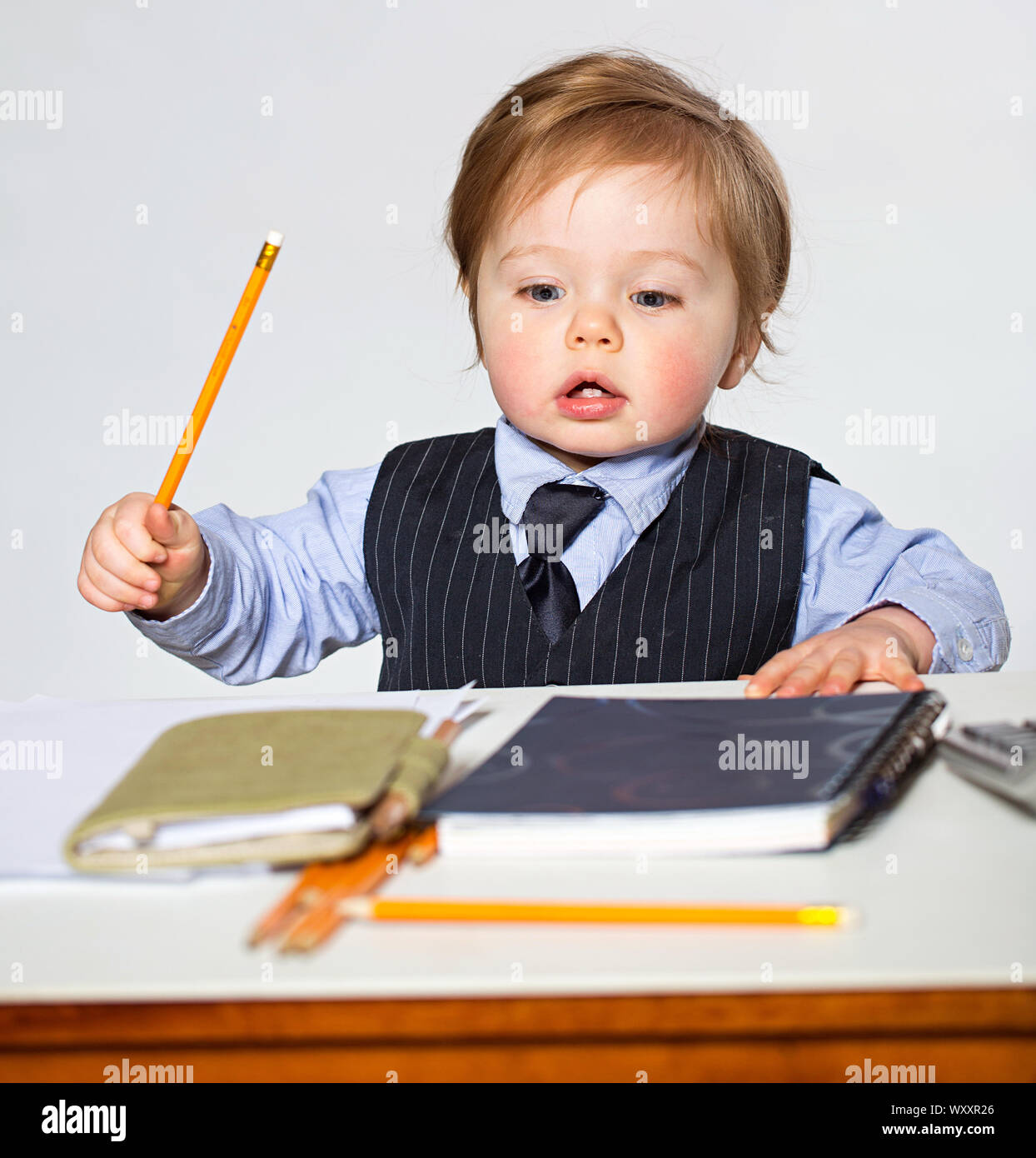 Little businessman portrait in office Stock Photo - Alamy
