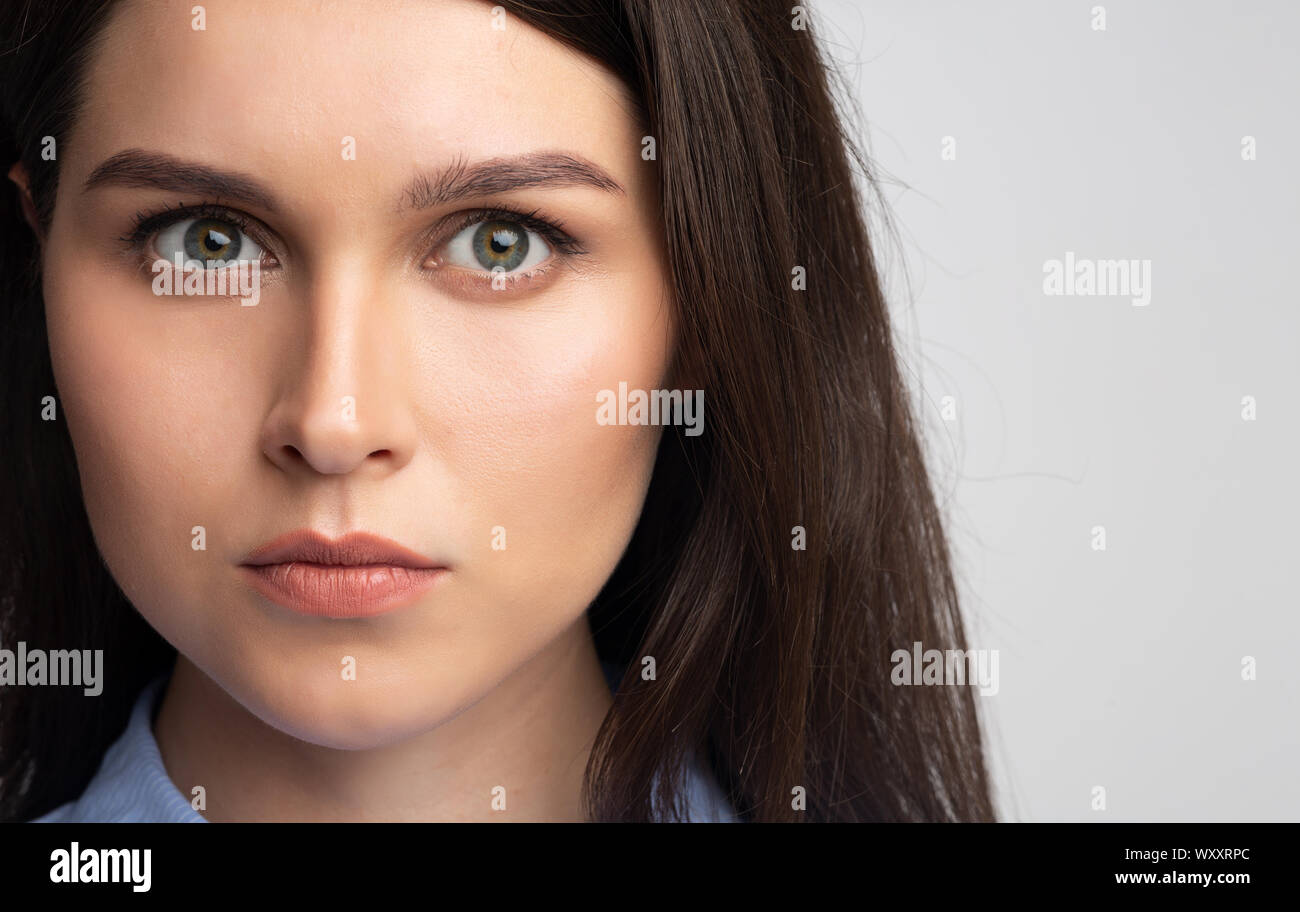 Portrait Of Woman Face Looking At Camera Over White Background Stock ...