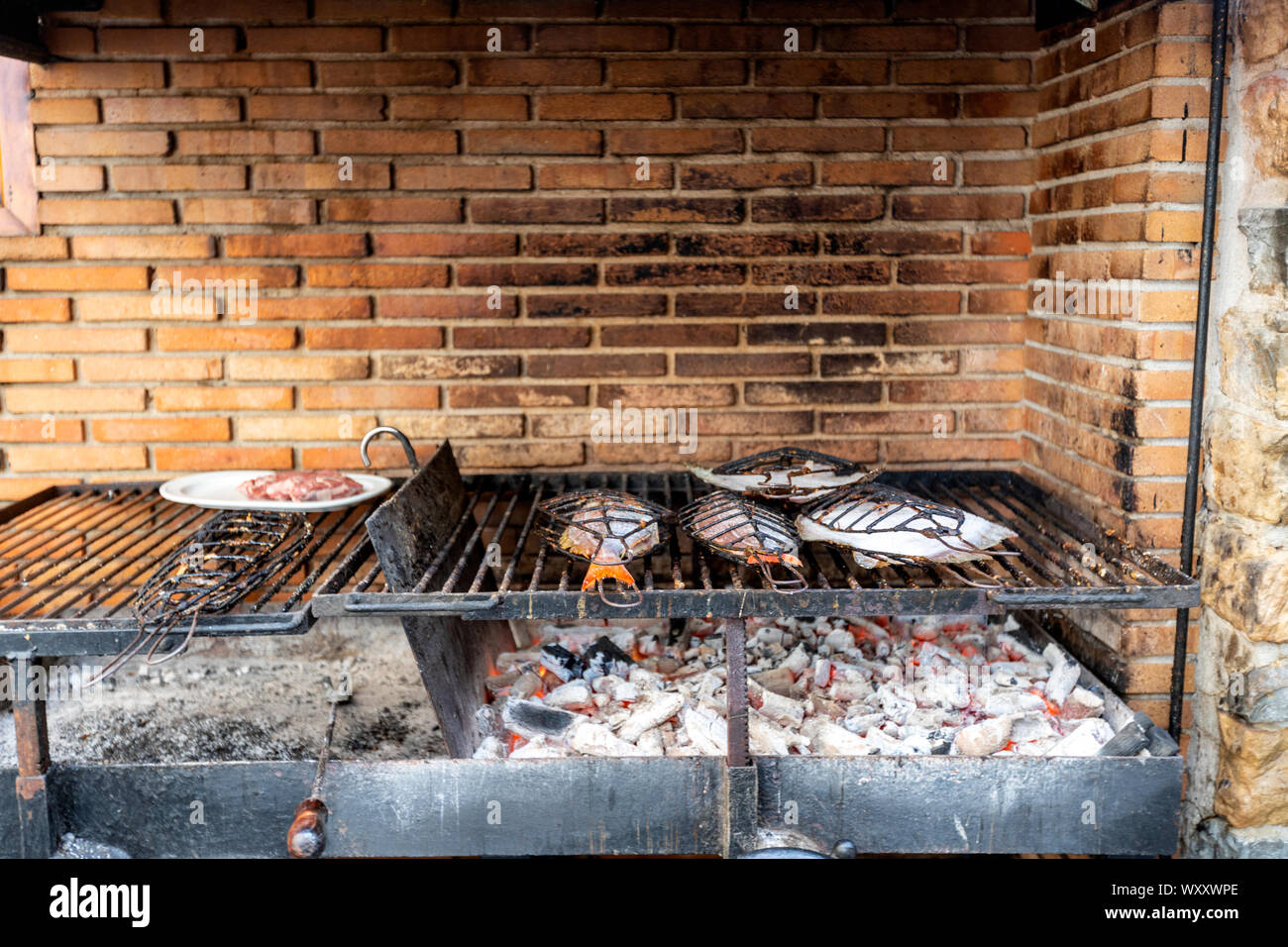 Preparing the fish in the grill in Asador Iribar restaurant in Getaria ...