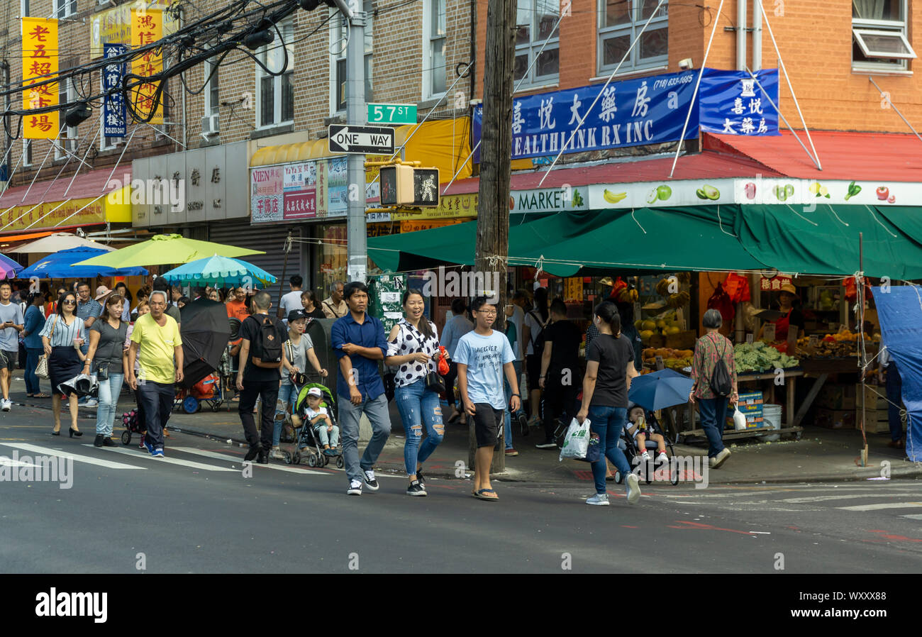 Thousands of people on Eighth Avenue in the Sunset Park neighborhood in Brooklyn in New York on ...