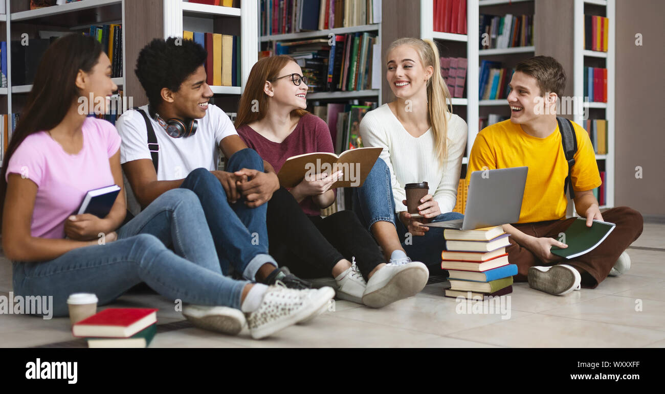 Group of international students talking over homework Stock Photo - Alamy