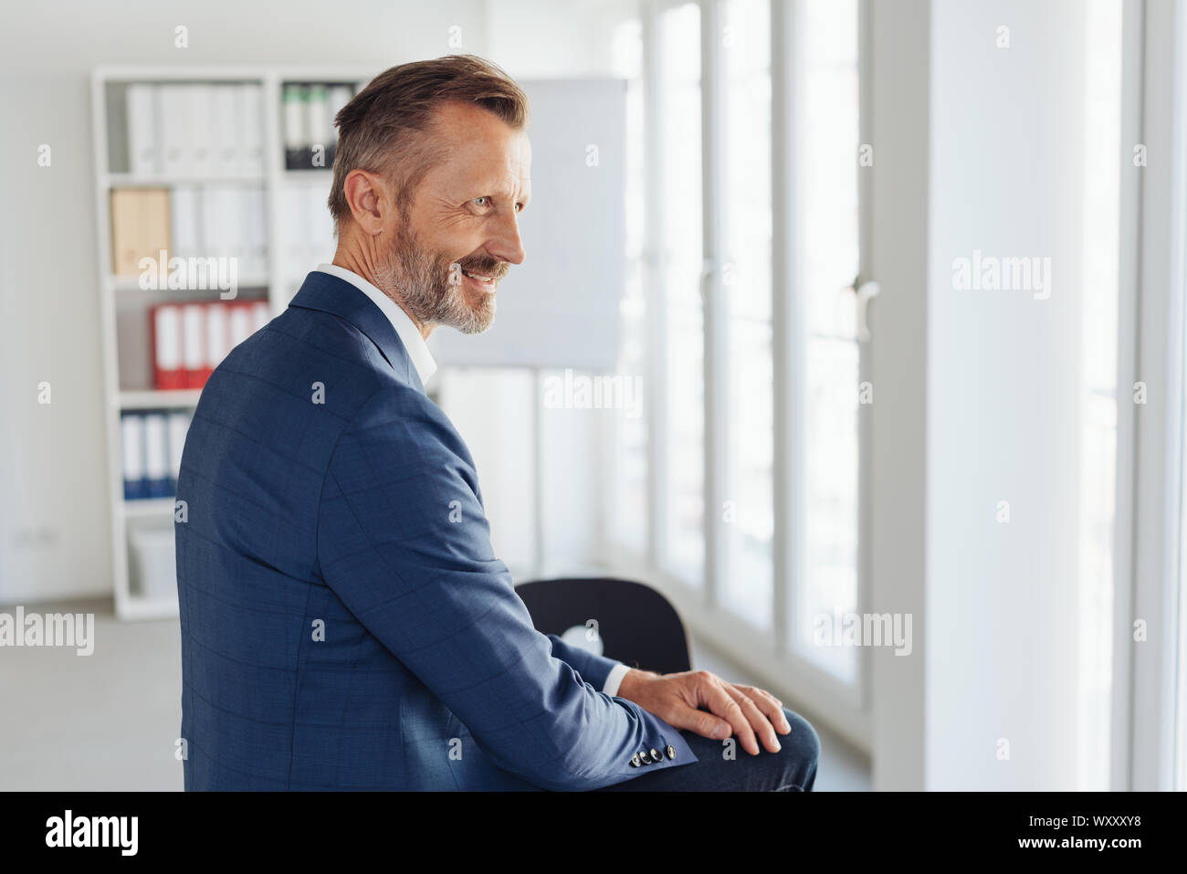 Man desk looking out window hi-res stock photography and images - Alamy
