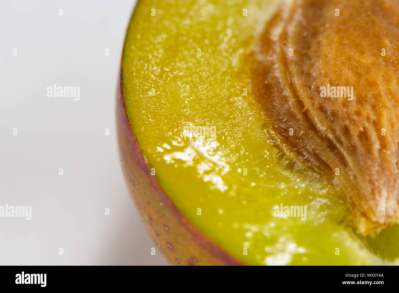 Fresh plum close up photography in white background Stock Photo - Alamy