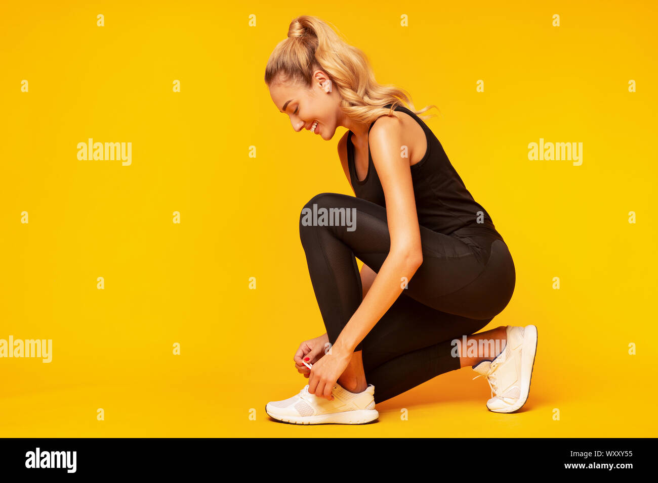 Girl lacing her shoes hi-res stock photography and images - Alamy