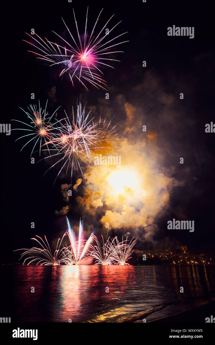 Fireworks on the night of Ferragosto on Bolsena Lake, with a bright ...