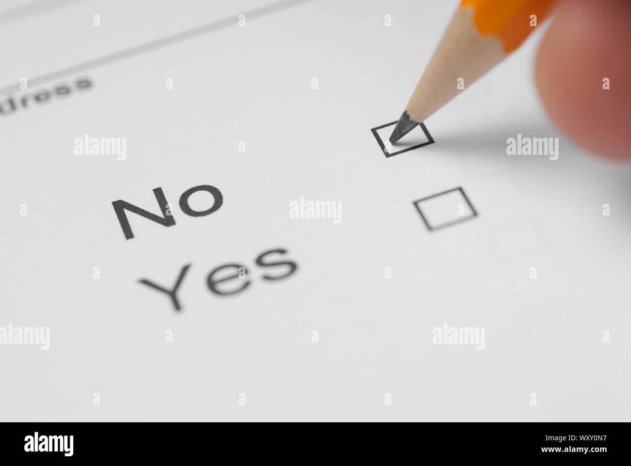 Filling in a form with a pencil, close up photo Stock Photo - Alamy