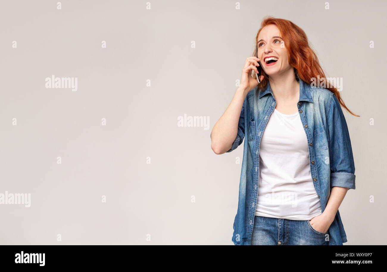 Beautiful teenage girl having pleasant phone call Stock Photo - Alamy