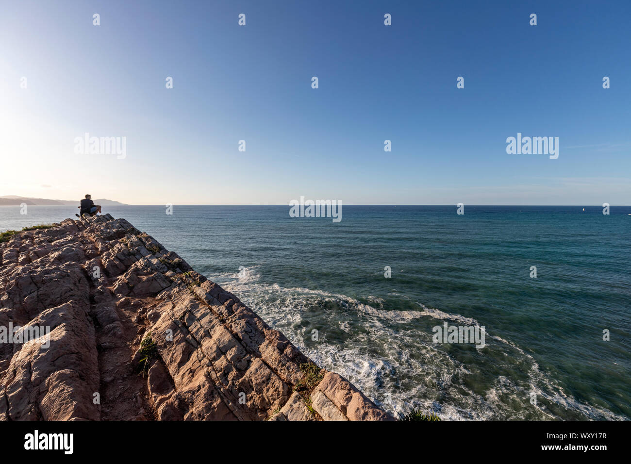 People walking in a path to spectacular coastal scenery, Zumaia, Basque ...
