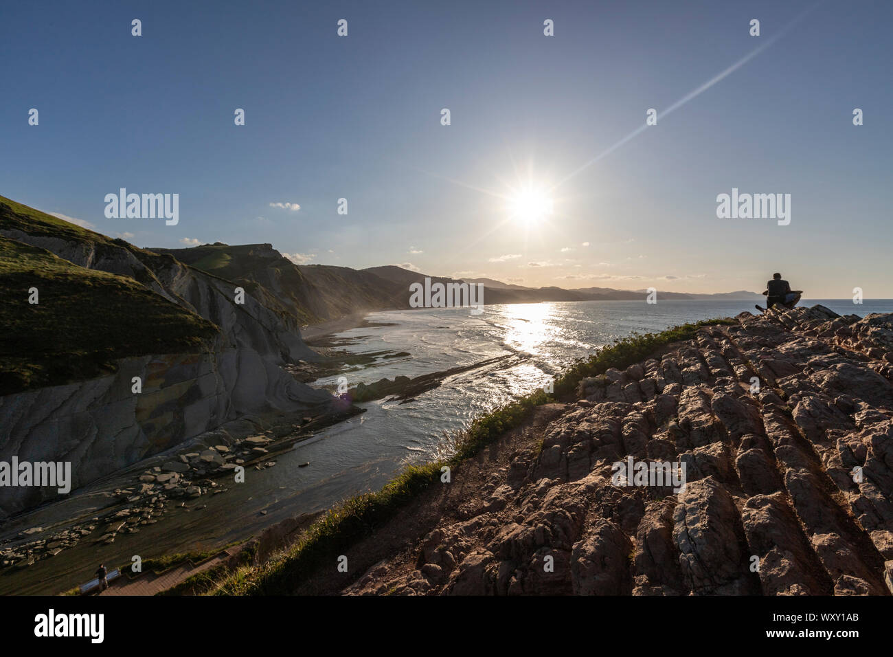 Couple in a path to spectacular coastal scenery, Zumaia, Basque Country ...