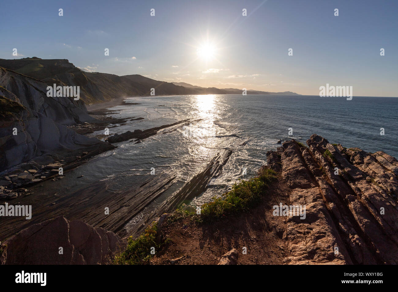People walking in a path to spectacular coastal scenery, Zumaia, Basque ...