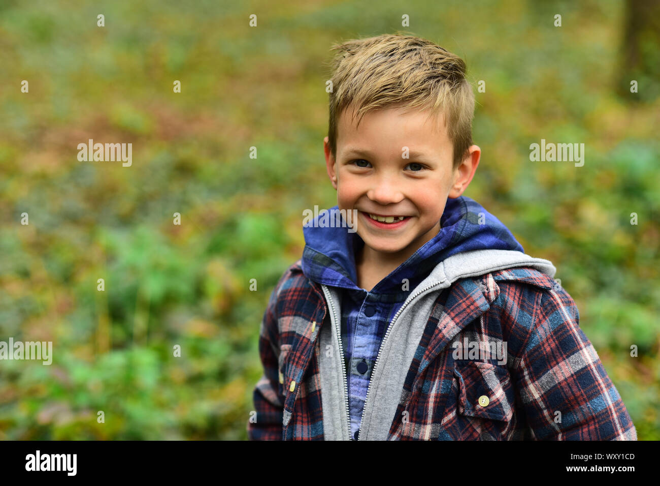 I never get tired of smiling. Little boy happy smiling outdoor. Happy ...