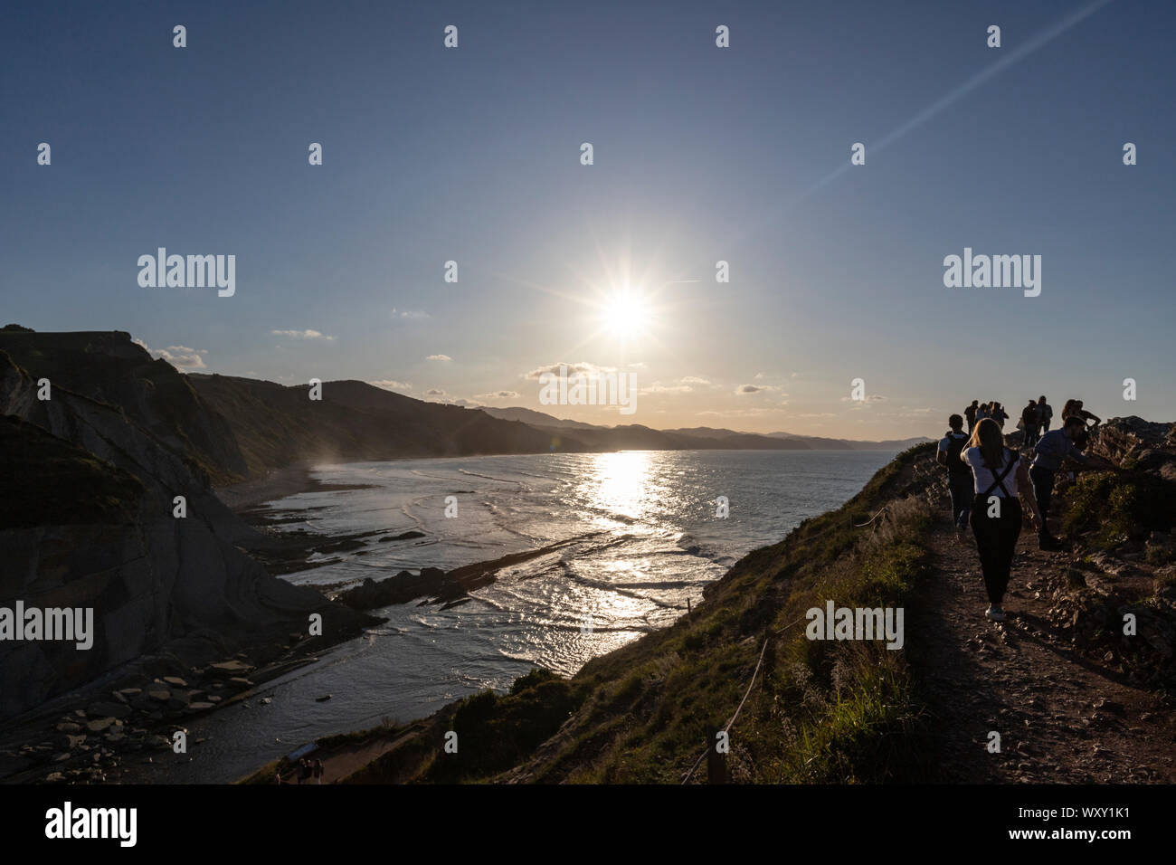 People walking in a path to spectacular coastal scenery, Zumaia, Basque ...
