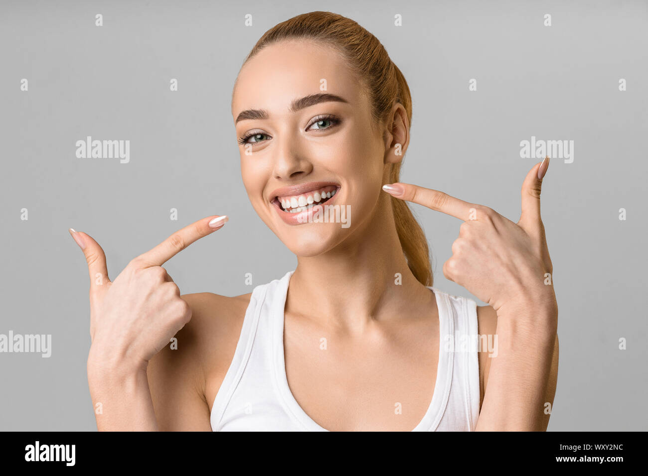 Orthodontic concept. Happy girl showing her beaming white teeth Stock ...