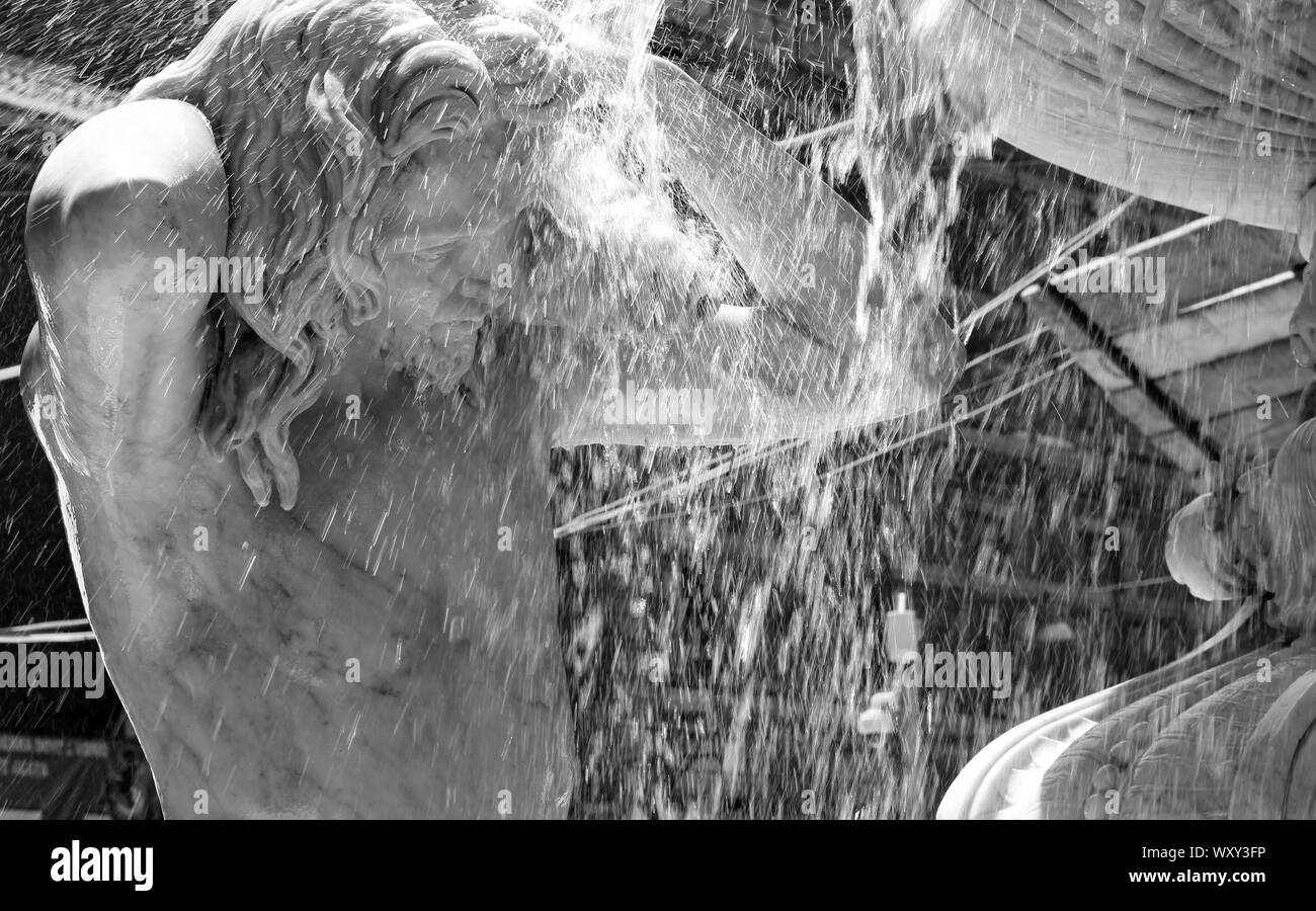 The water flow near the fountain with marble figures. Italy Stock Photo ...
