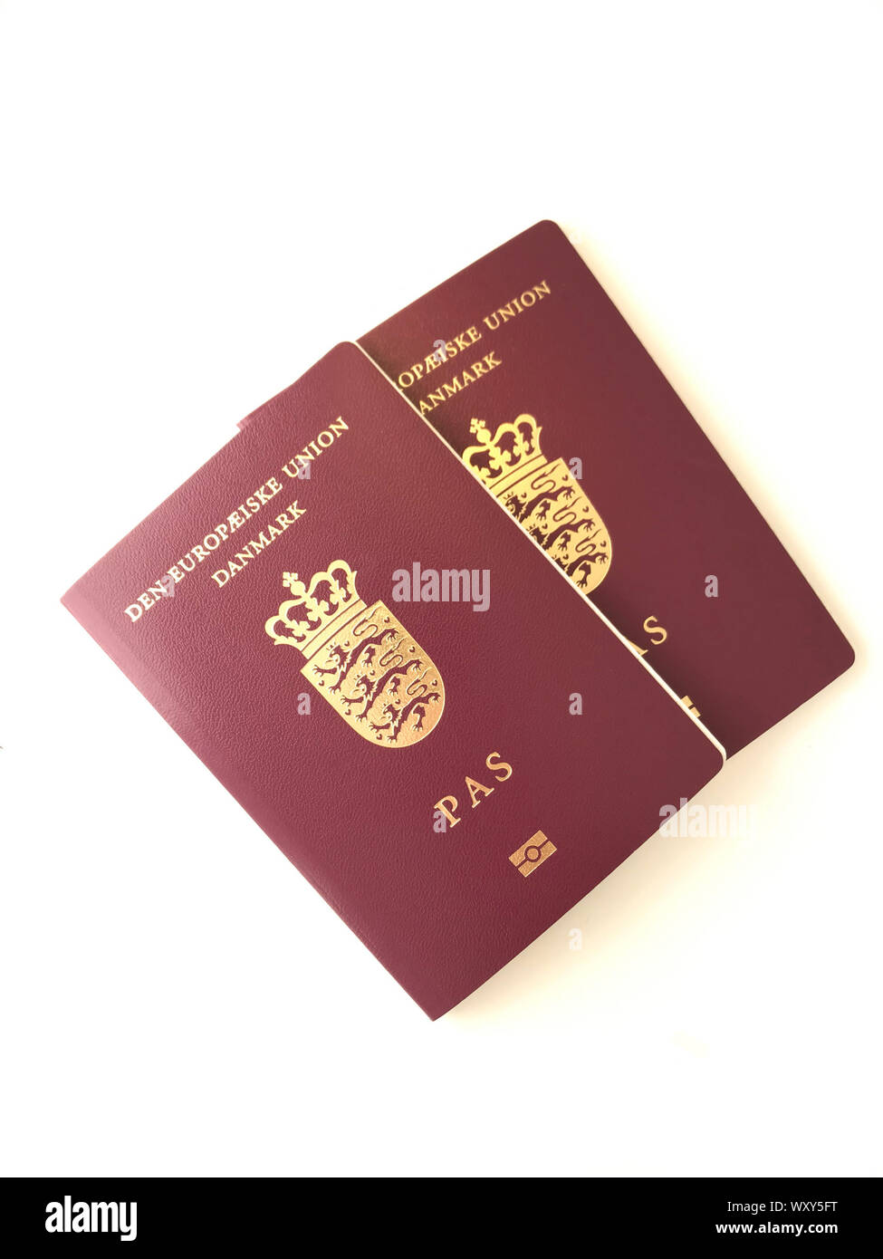 Two new danish passports on the white background Stock Photo - Alamy