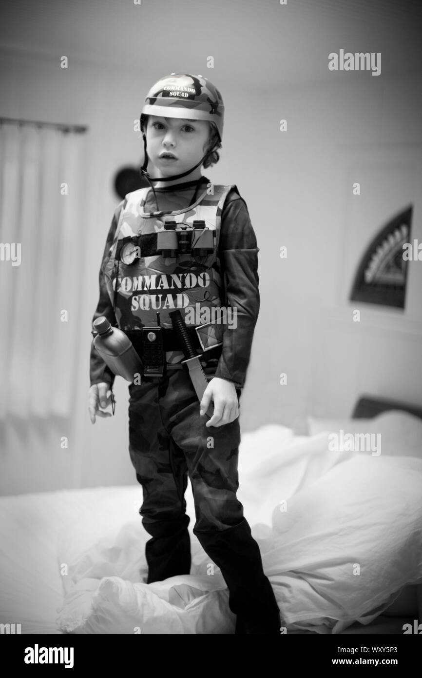 Boy in posing as a commando Stock Photo - Alamy