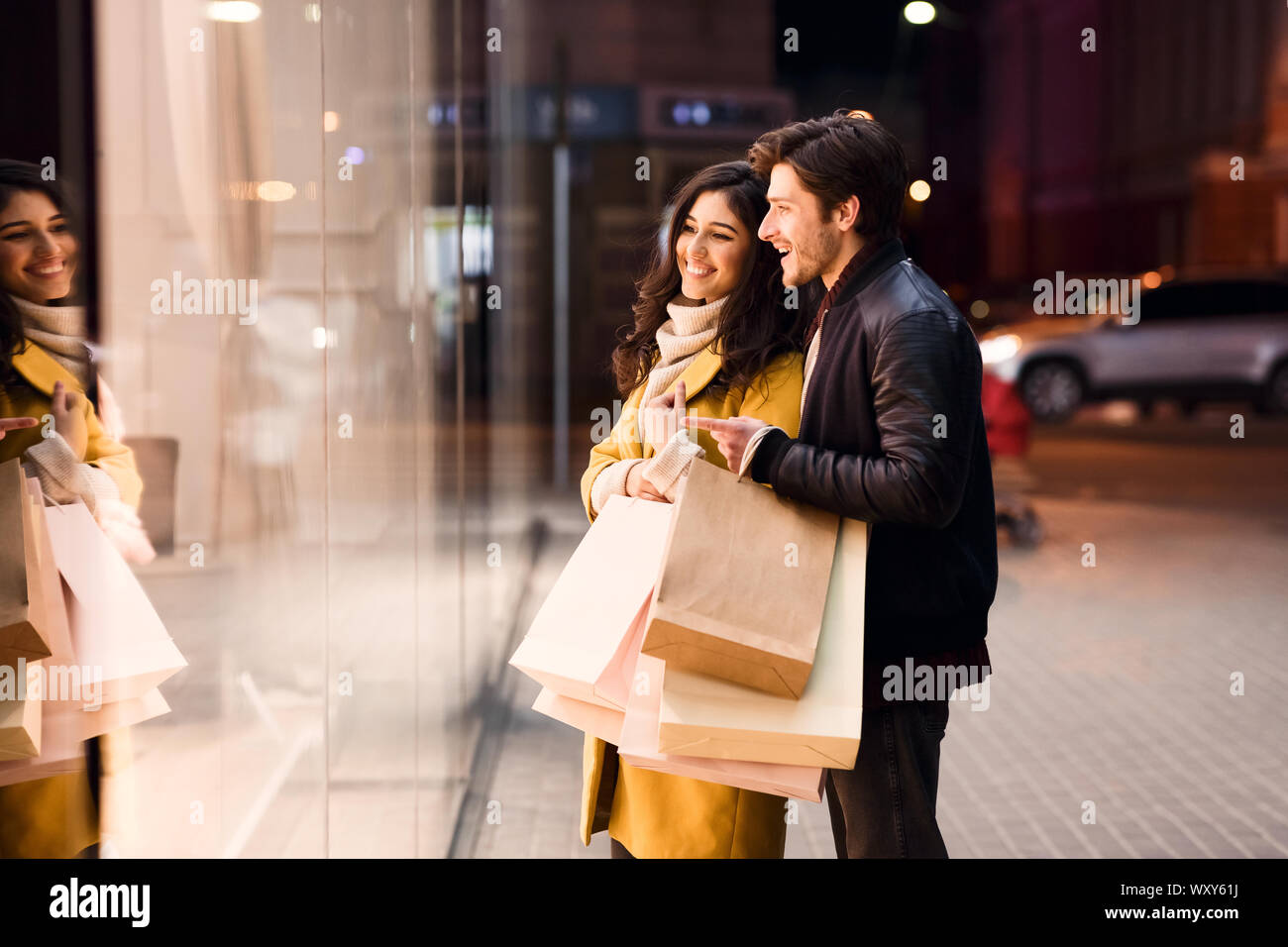 Woman window shopping temptation window hi-res stock photography and ...