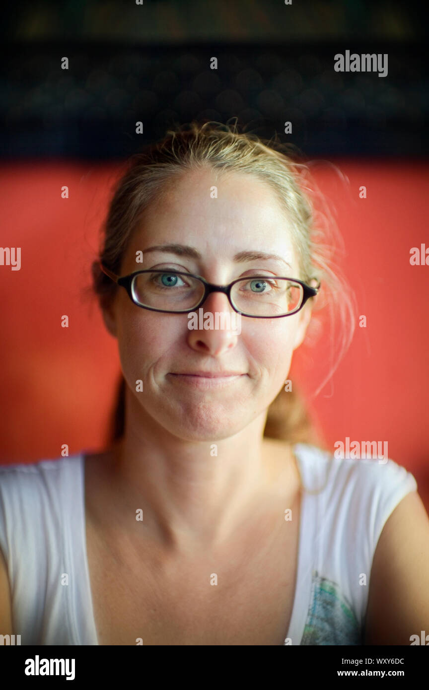 Portrait of a woman giving an excited look Stock Photo - Alamy