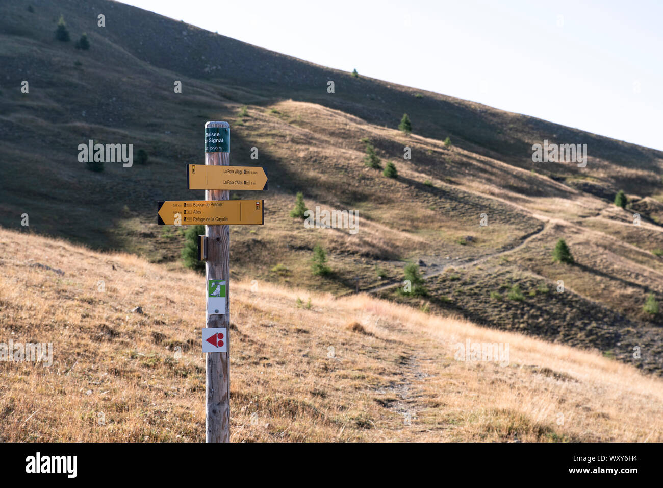 direction signs on hiking trails with place names noted on them, as ...