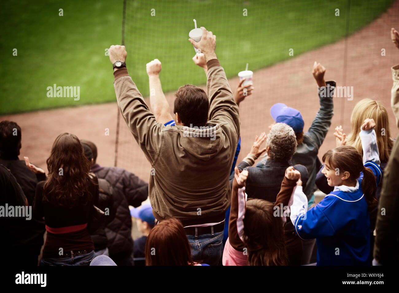 View of spectators cheering together Stock Photo - Alamy
