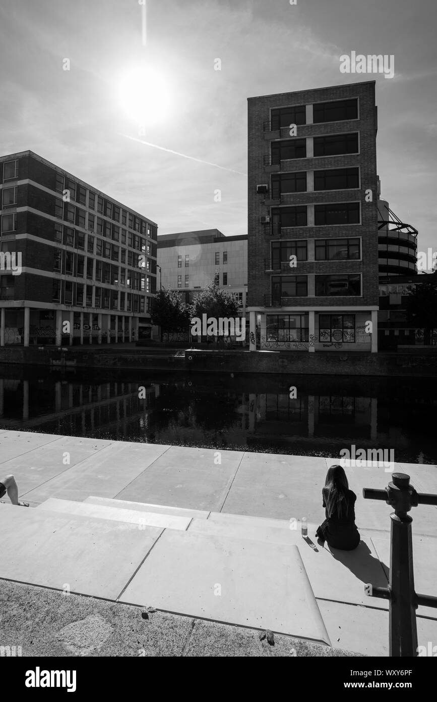 Girl sitting on new Black and White Stock Photos & Images - Alamy