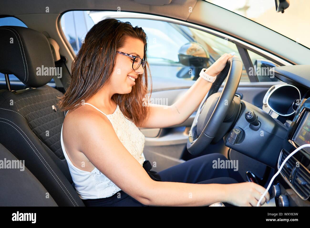 Young driver woman driving car Stock Photo - Alamy