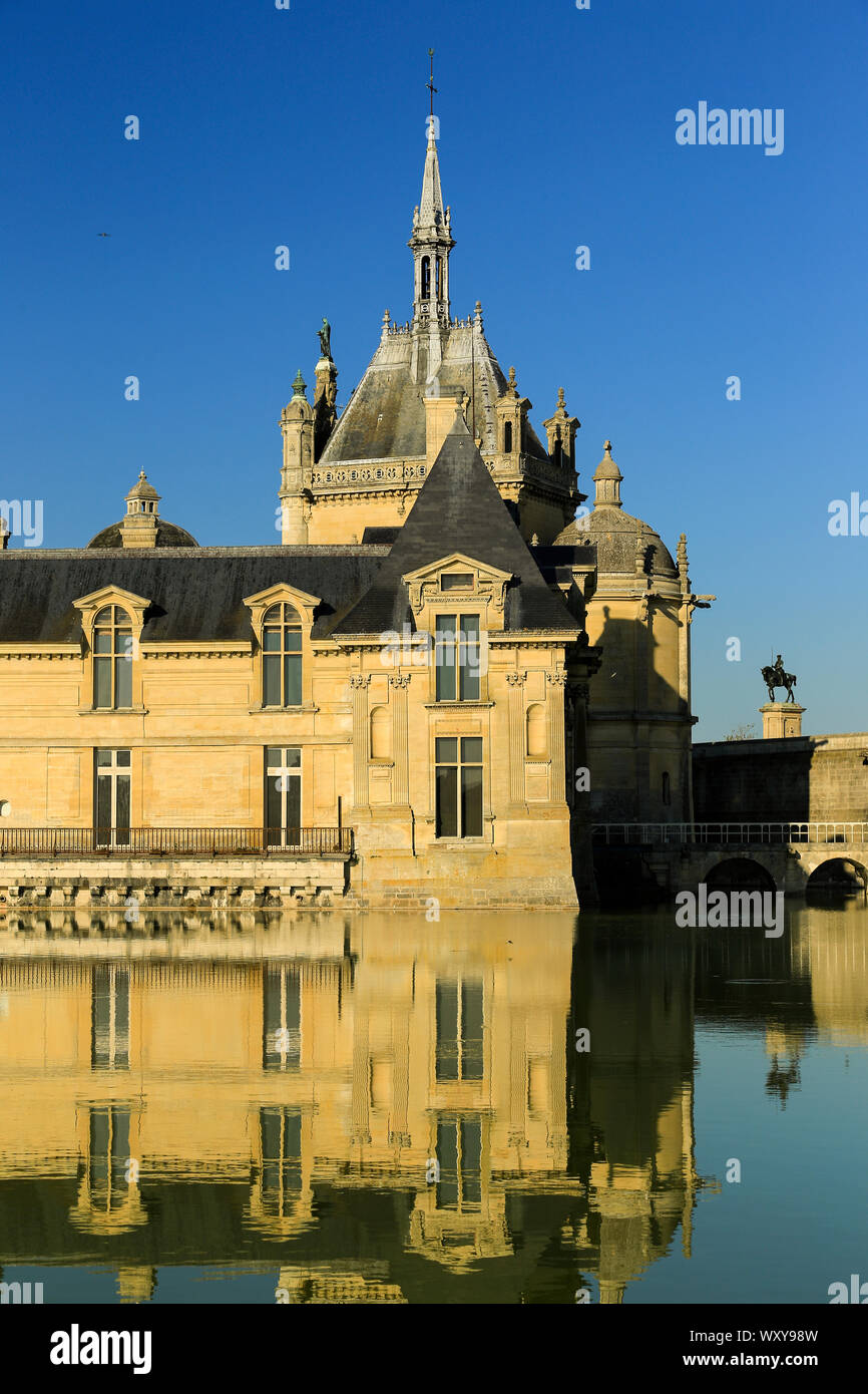 Classic Chateau de Chantilly on its lake outside Paris, France Stock ...